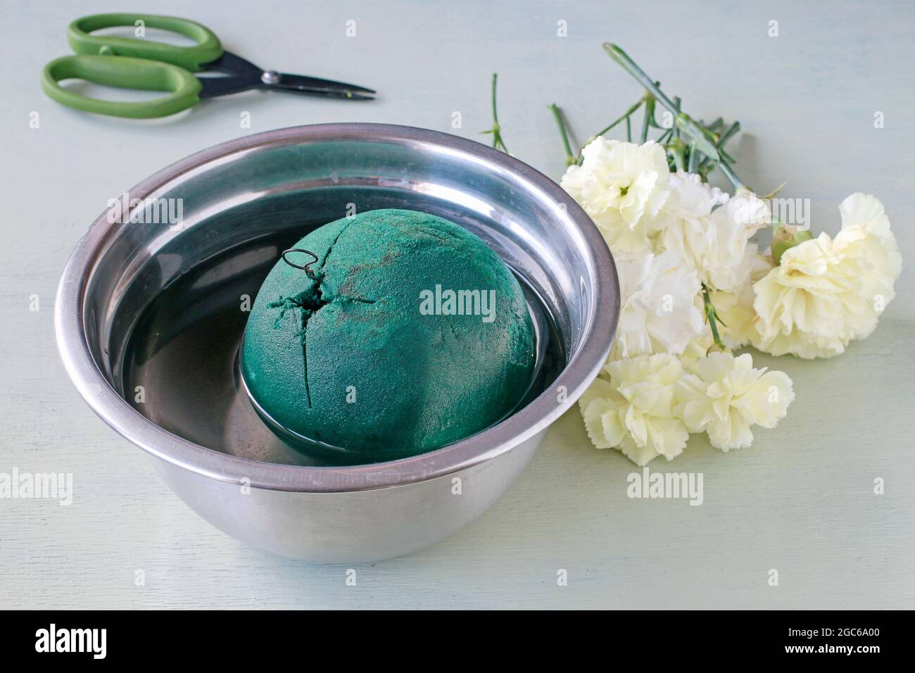 Florist at work: How to make carnation pomander ball, popular wedding decoration. Step by step ...