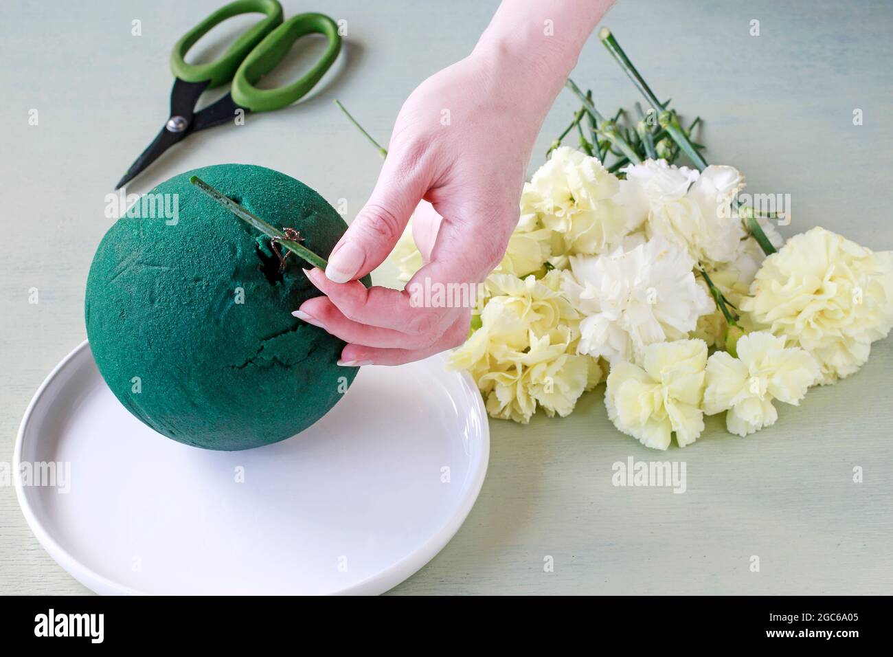 Florist at work: How to make carnation pomander ball, popular wedding decoration. Step by step ...