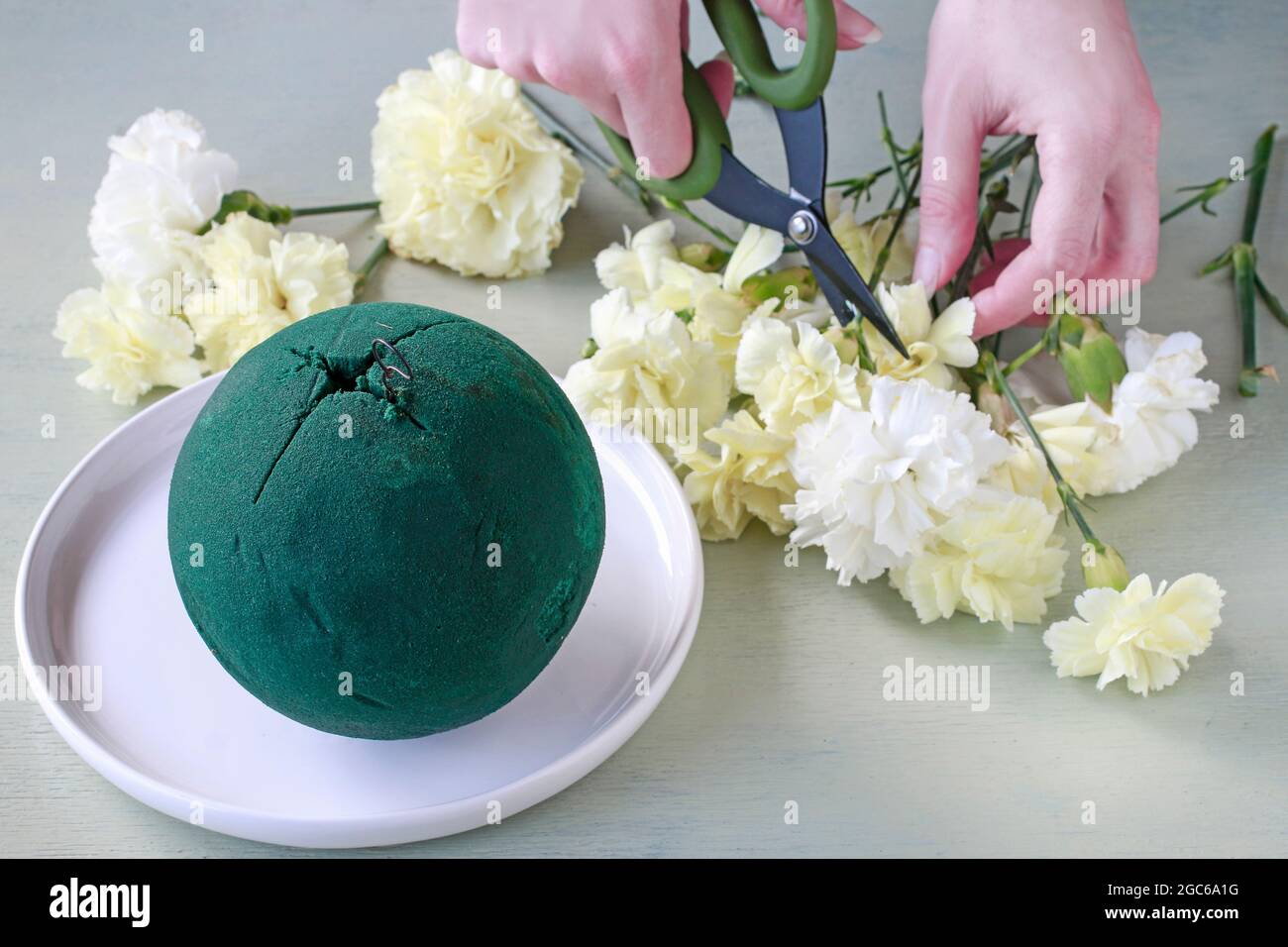 Florist at work: How to make carnation pomander ball, popular wedding decoration. Step by step ...
