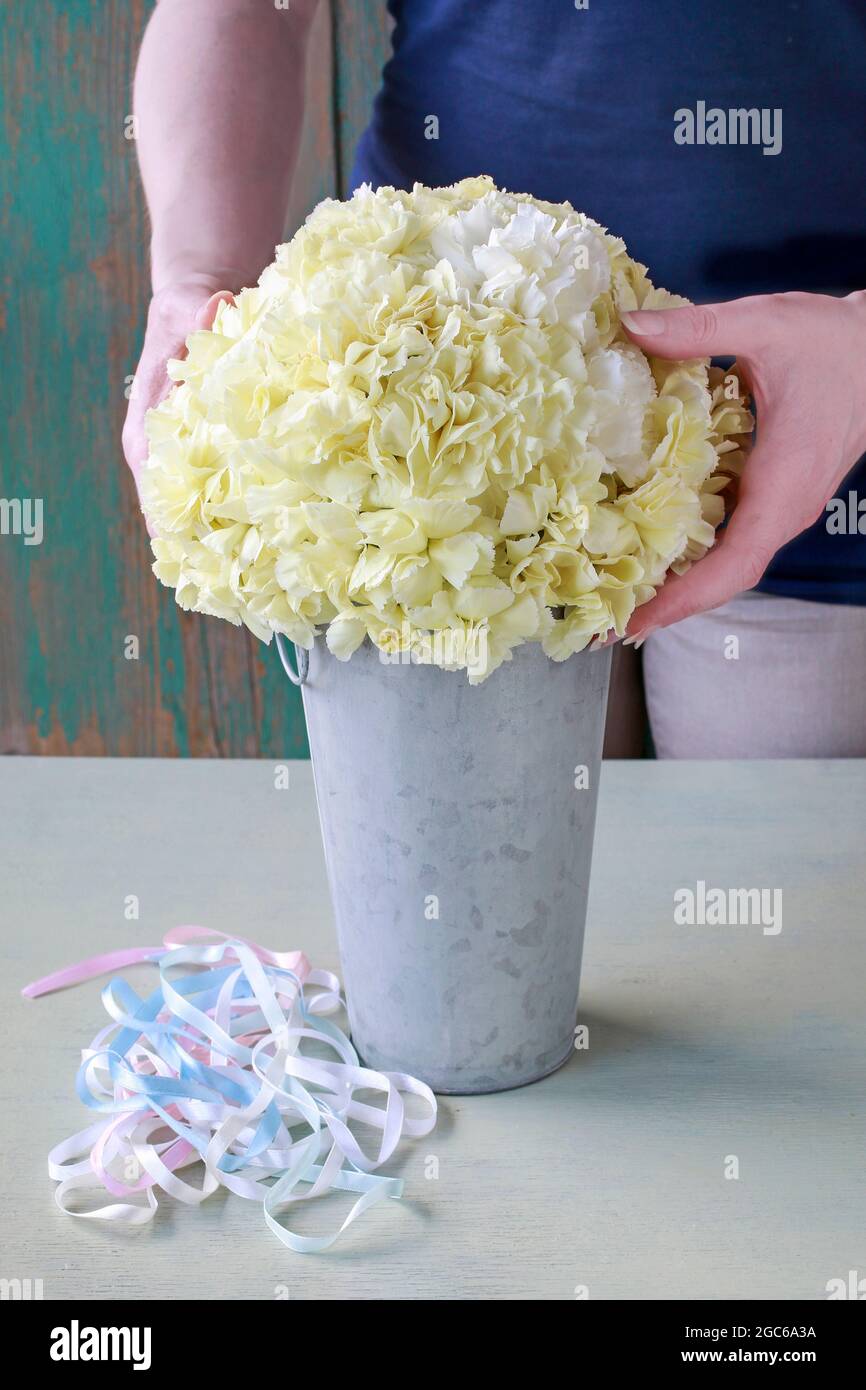 Florist at work: How to make carnation pomander ball, popular wedding decoration. Step by step ...