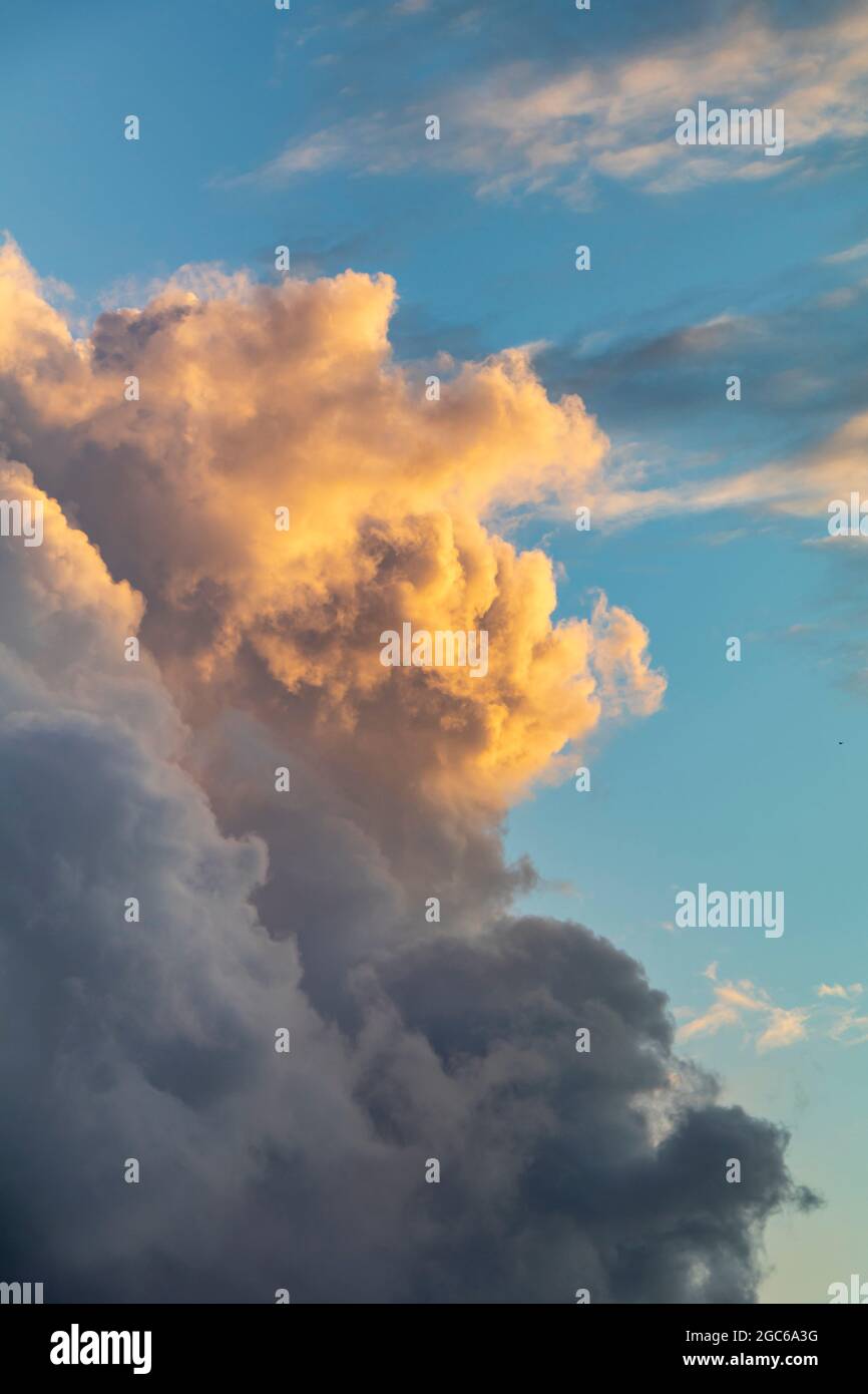 The setting sun light up some of the cloud cover Stock Photo - Alamy