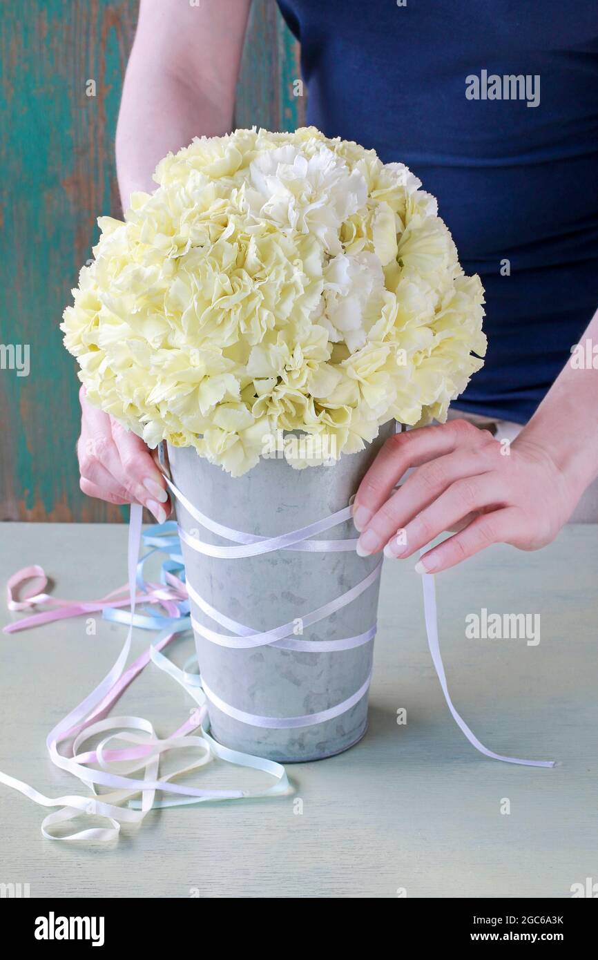 Florist at work: How to make carnation pomander ball, popular wedding decoration. Step by step ...