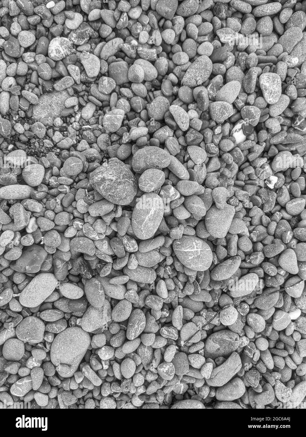 Grayscale shot of smooth stones on a beach Stock Photo - Alamy