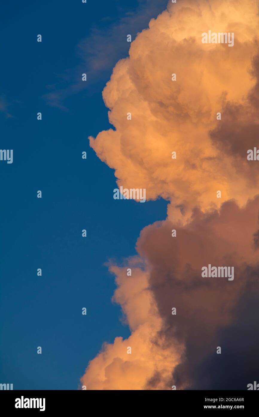 The setting sun light up some of the cloud cover Stock Photo - Alamy