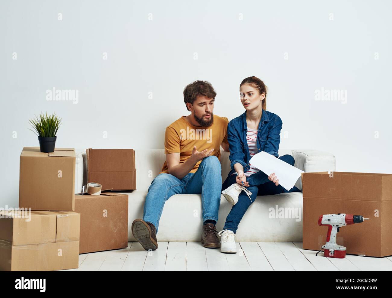 husband and wife unpack things in a new apartment interior renovation ...