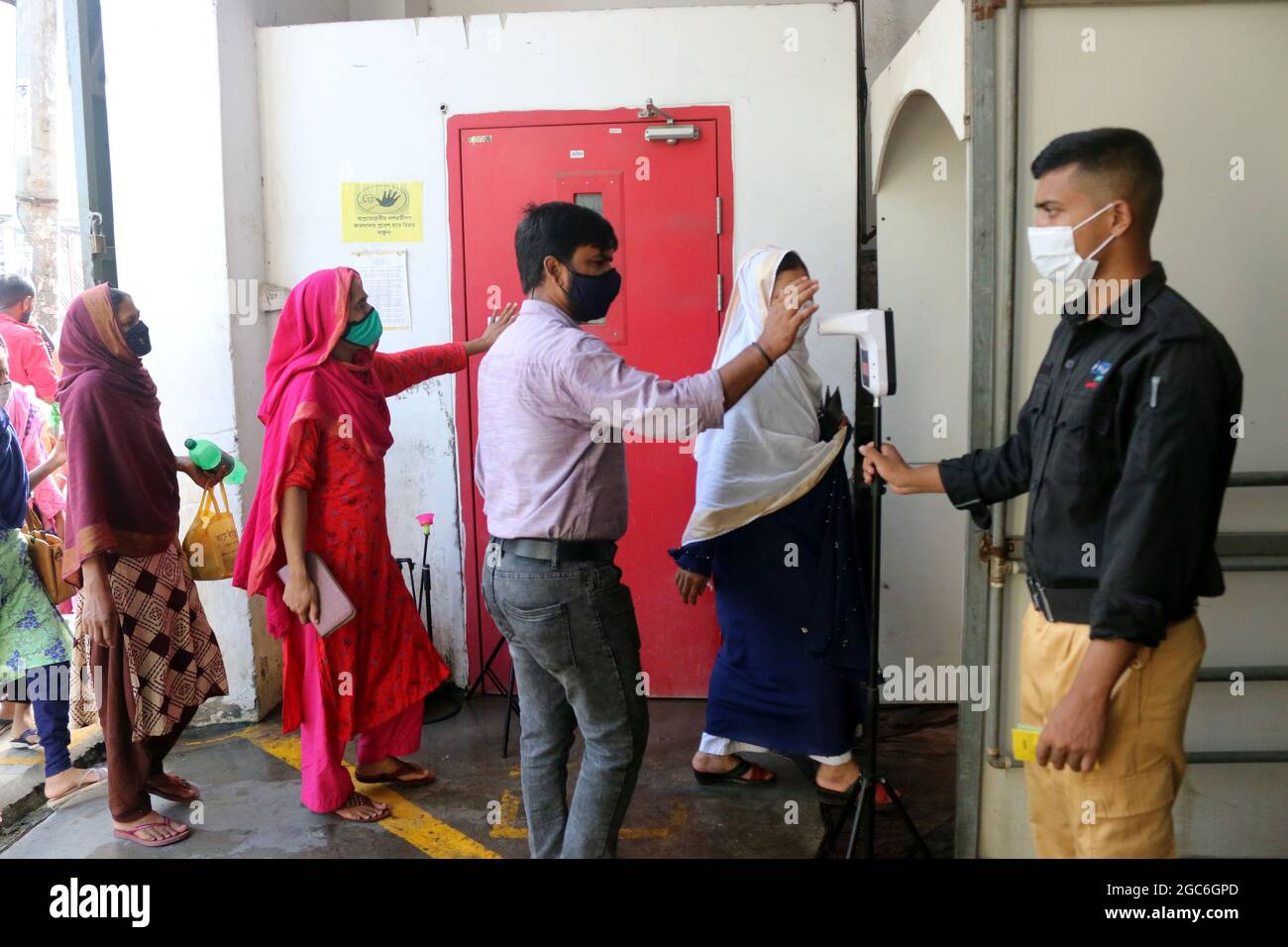 August 05,2021,Dhaka,Bangladesh: Security personal checks the body ...