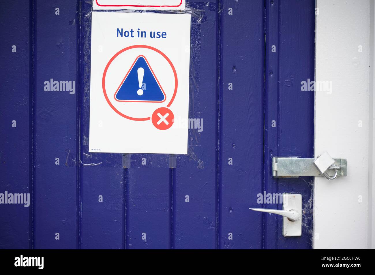 Not in use sign on door at train station Stock Photo - Alamy