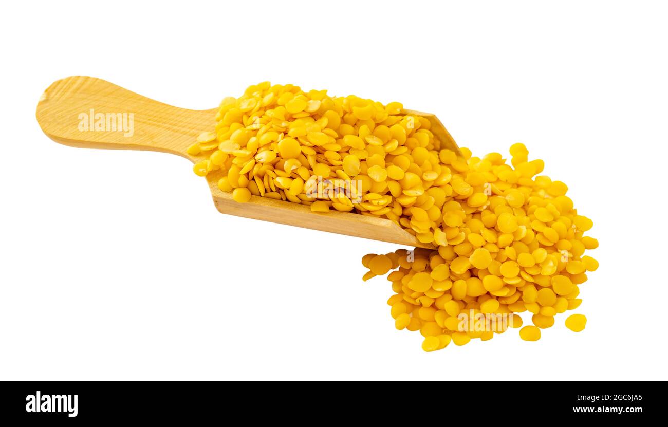 Organic yellow lentils grains in wooden spoon. yellow lentils isolated ...