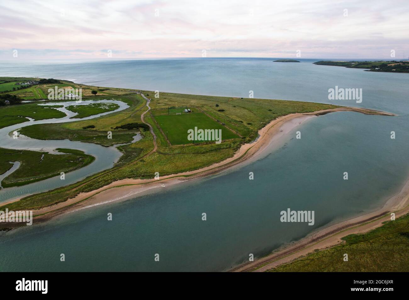 Aerial view of Pilmore Strand and the St Itas GAA pitch near Youghal in ...