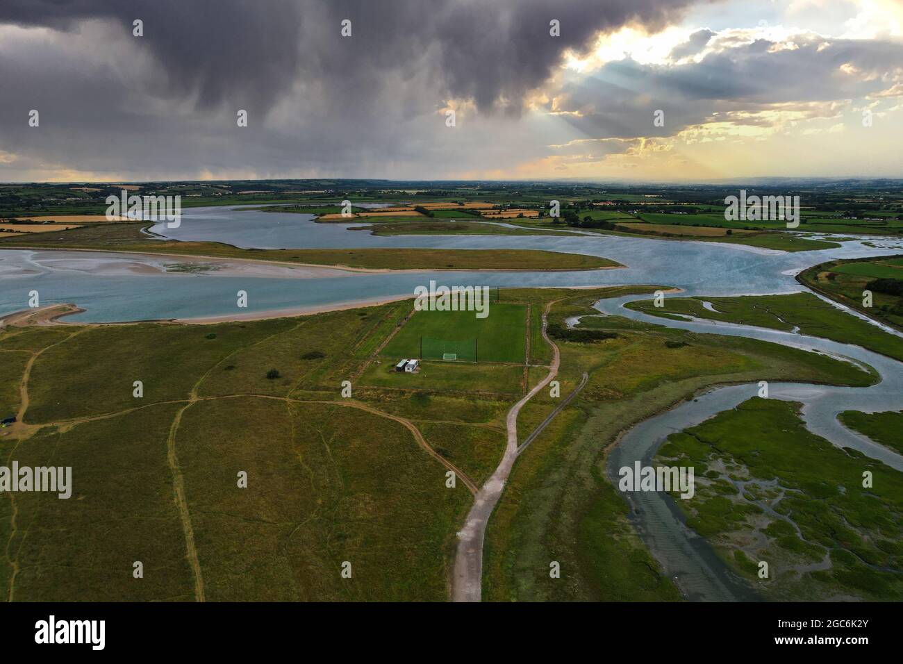 Aerial view of Pilmore Strand and the St Itas GAA pitch near Youghal in ...