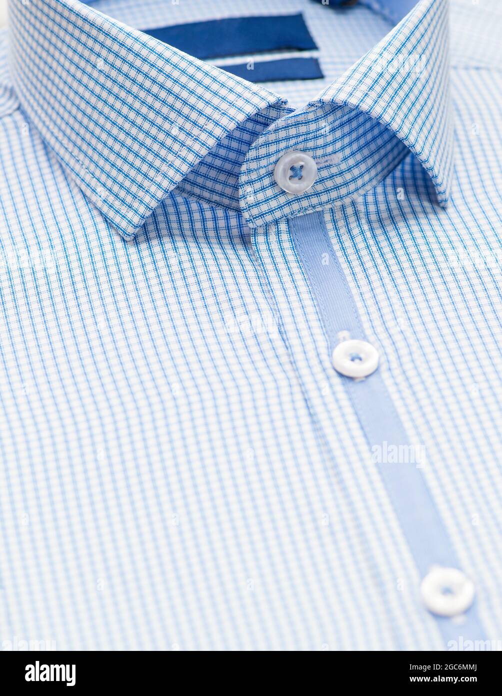 blue shirt with checkered pattern and with a focus on the collar and ...