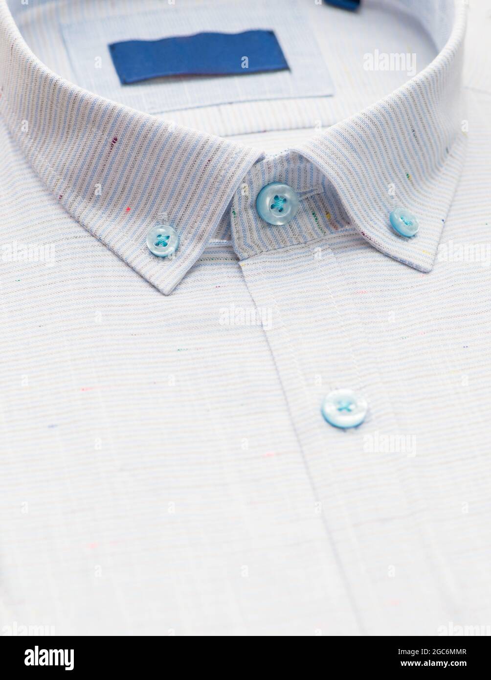 blue shirt with a focus on the collar and button, close-up Stock Photo ...