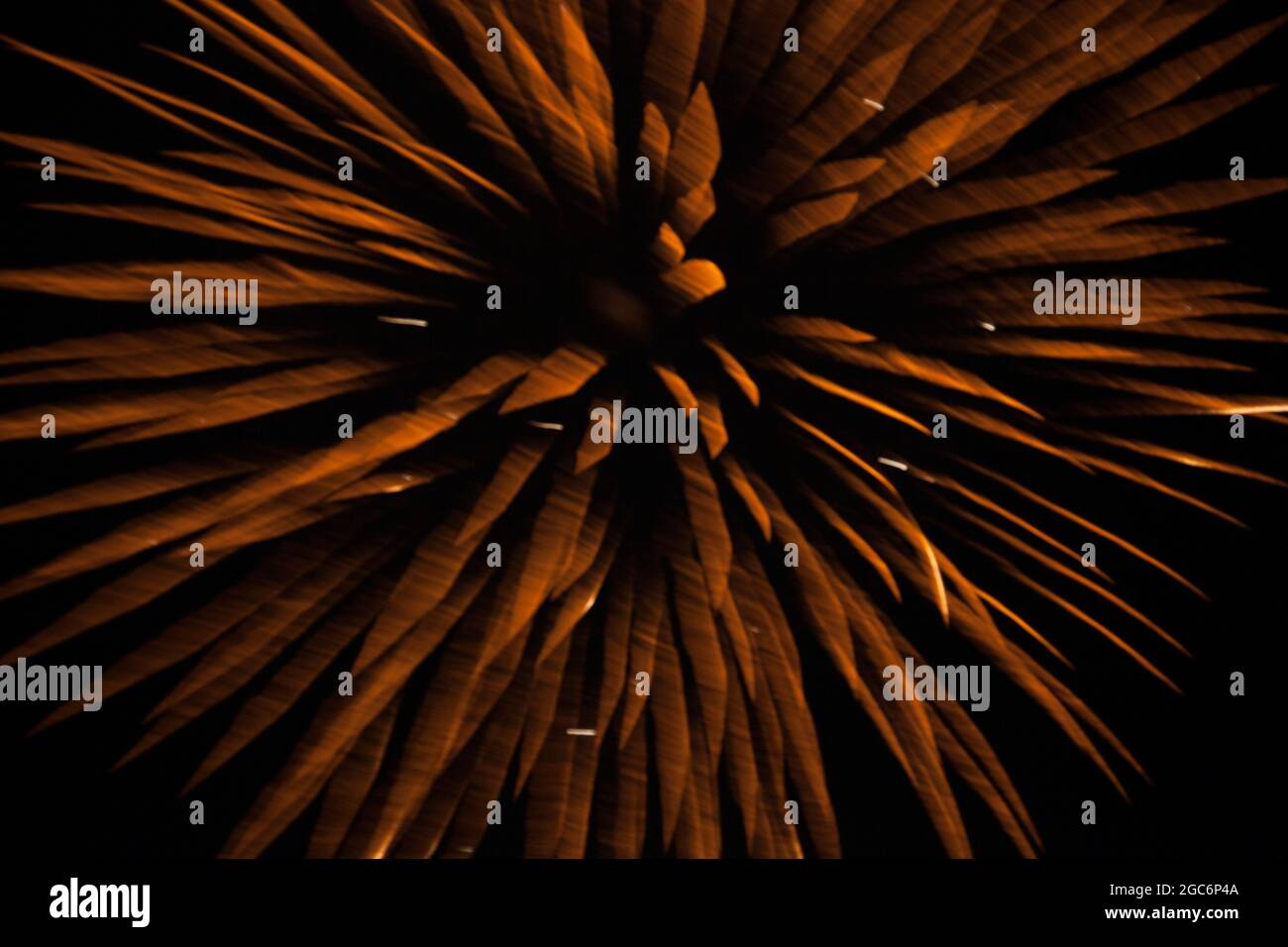 Exploding firework producing a beautiful cascading colourful display ...