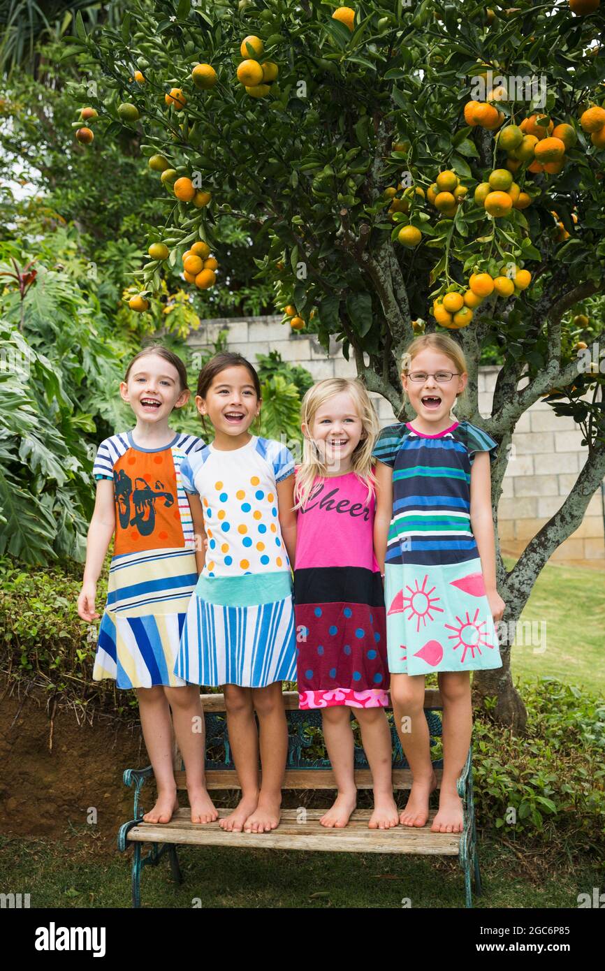 Girls laughing on bench hi-res stock photography and images - Alamy