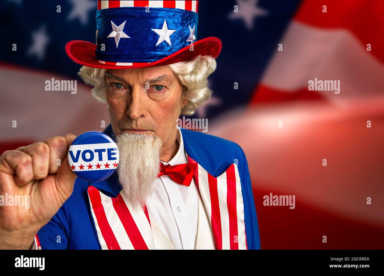 Uncle Sam holding vote pin Stock Photo - Alamy