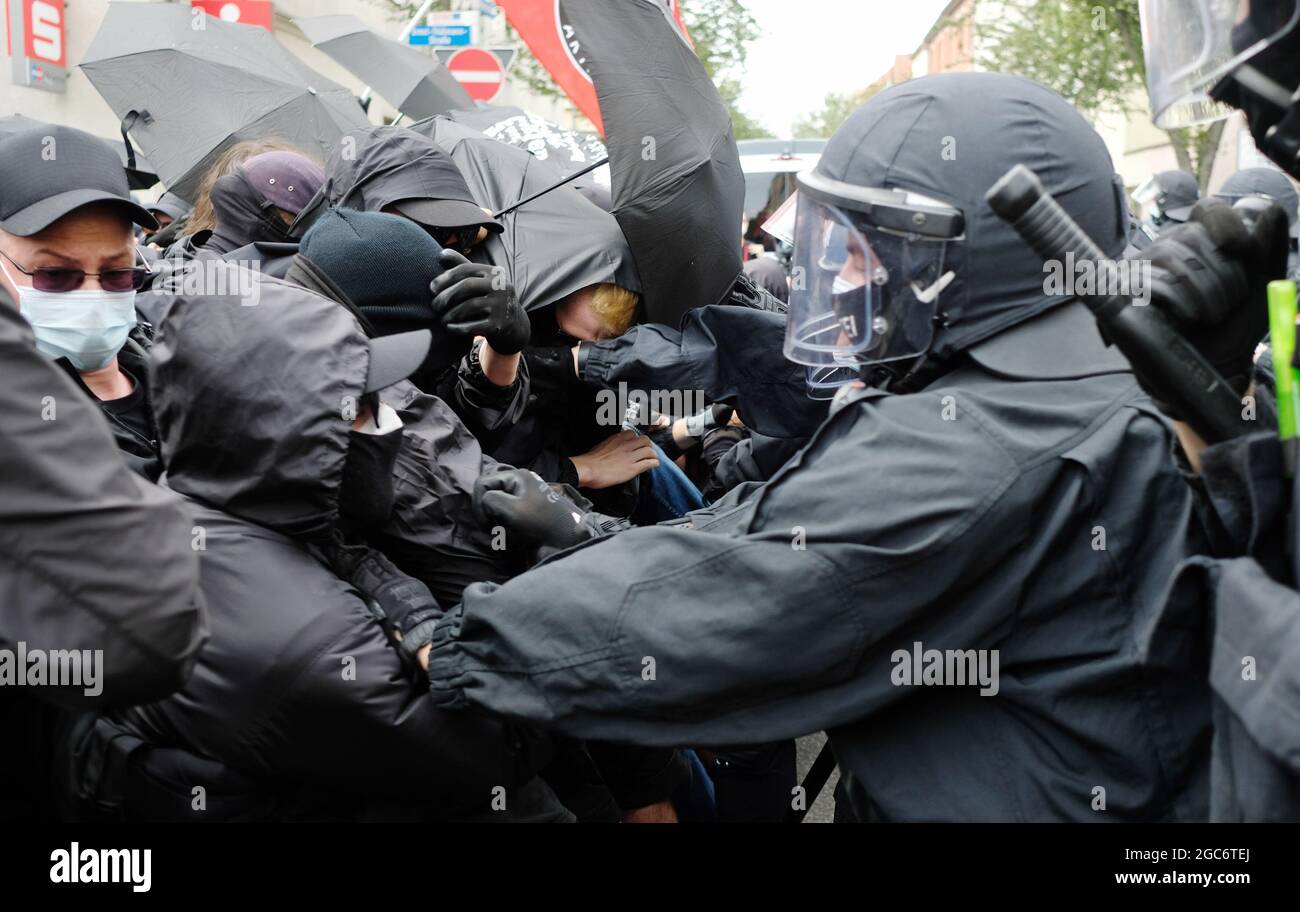 Weimar, Germany. 07th Aug, 2021. Police officers stop participants of a demonstration against a ...