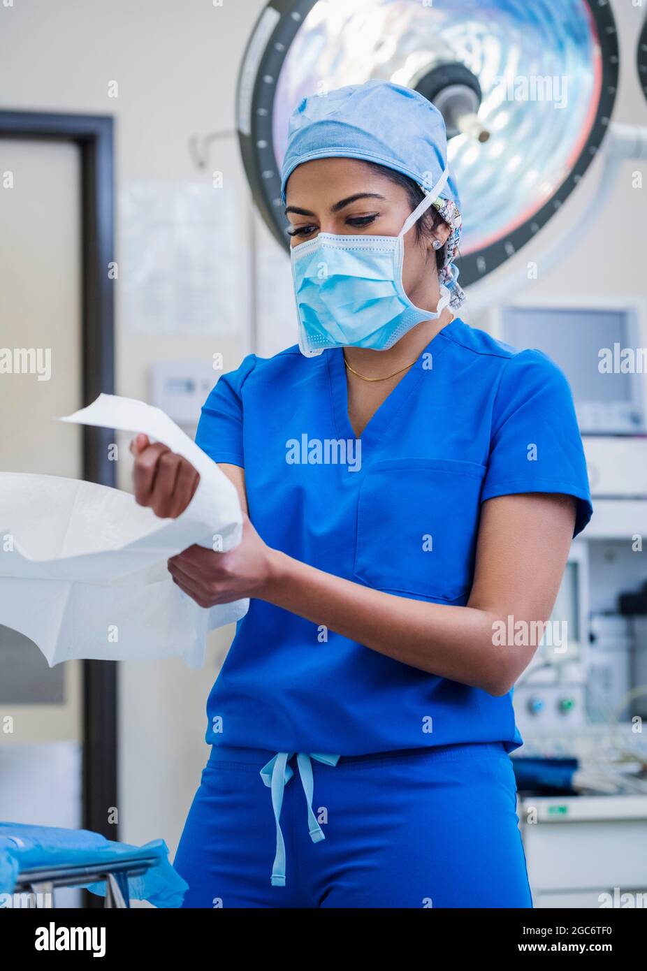 Female doctor preparing for surgery in operating theater Stock Photo ...