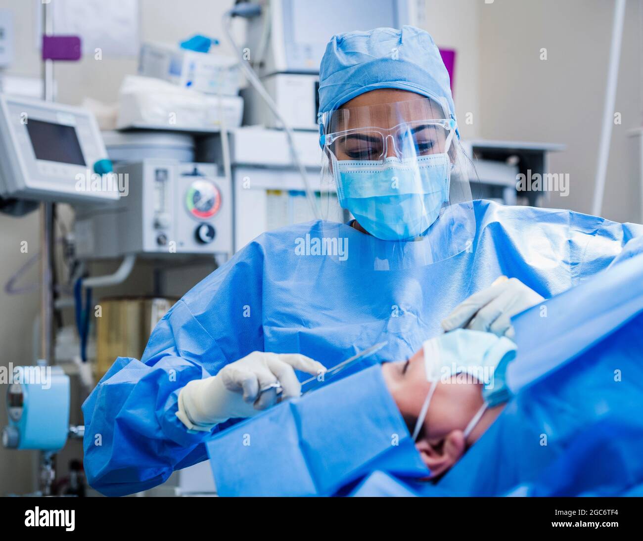 Doctor and patient during surgery Stock Photo - Alamy