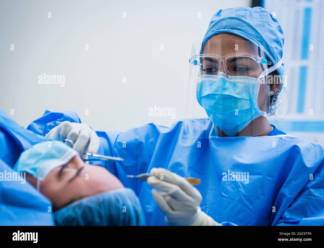 Doctor and patient during surgery Stock Photo - Alamy