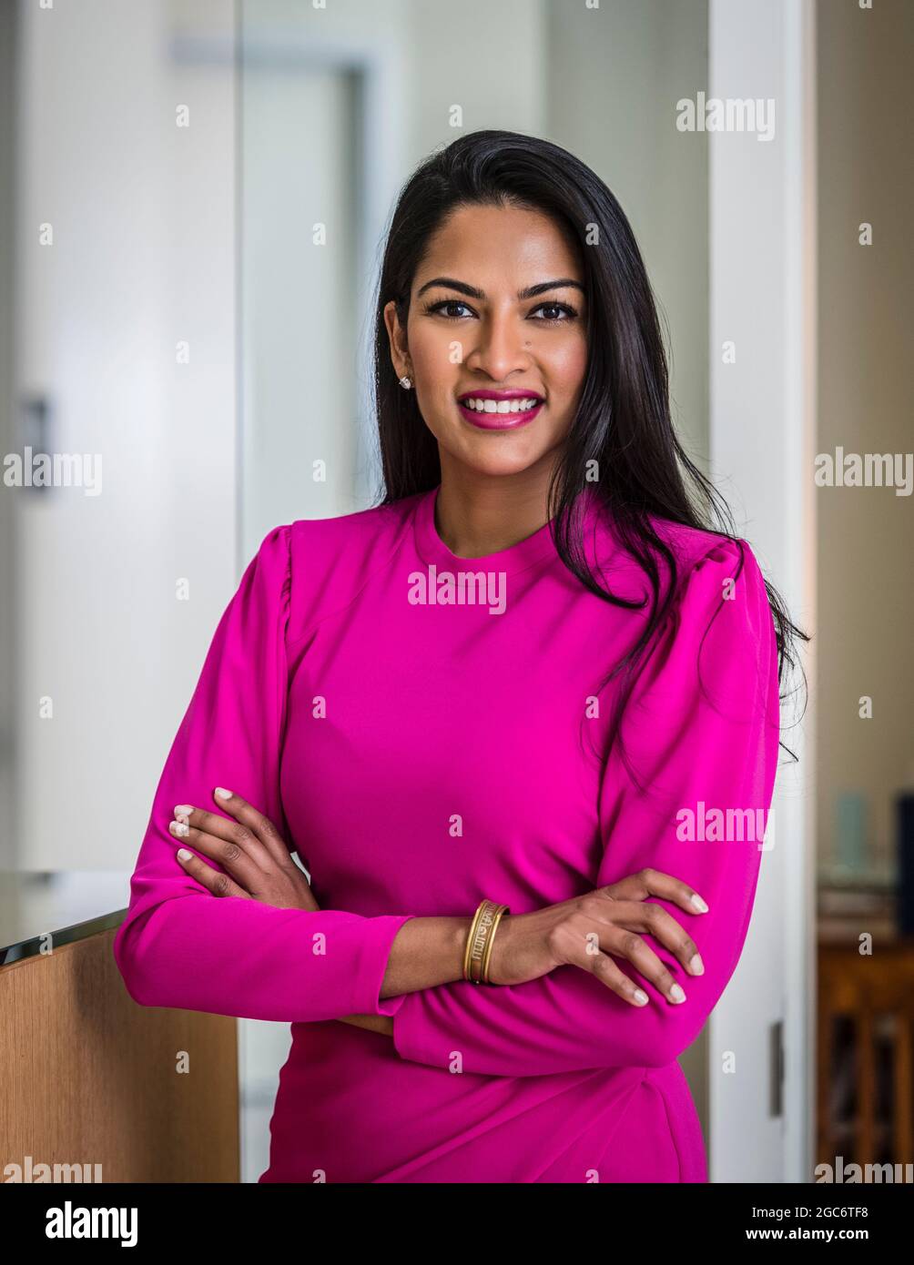 Portrait of beautiful woman at reception desk Stock Photo - Alamy