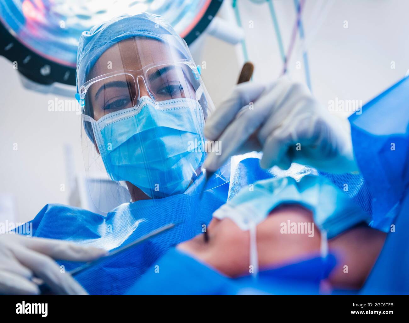 Doctor and patient during surgery Stock Photo - Alamy