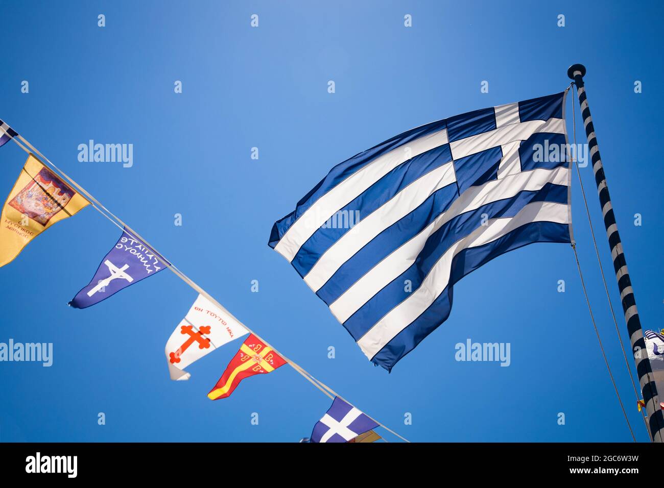 Flag of Greece in the wind on the island of Mykonos Stock Photo - Alamy