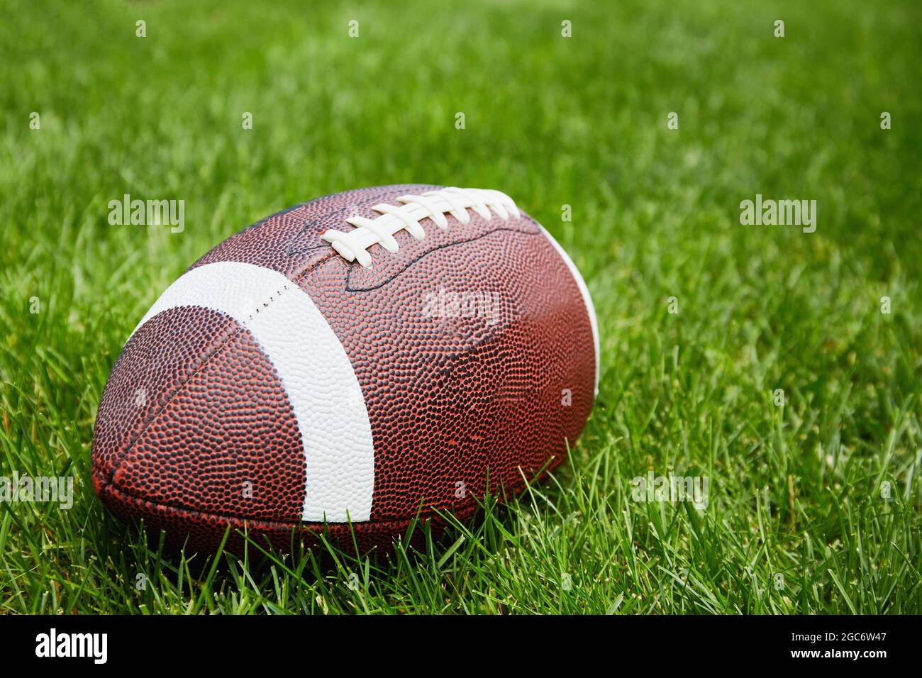 Football on grass Stock Photo - Alamy
