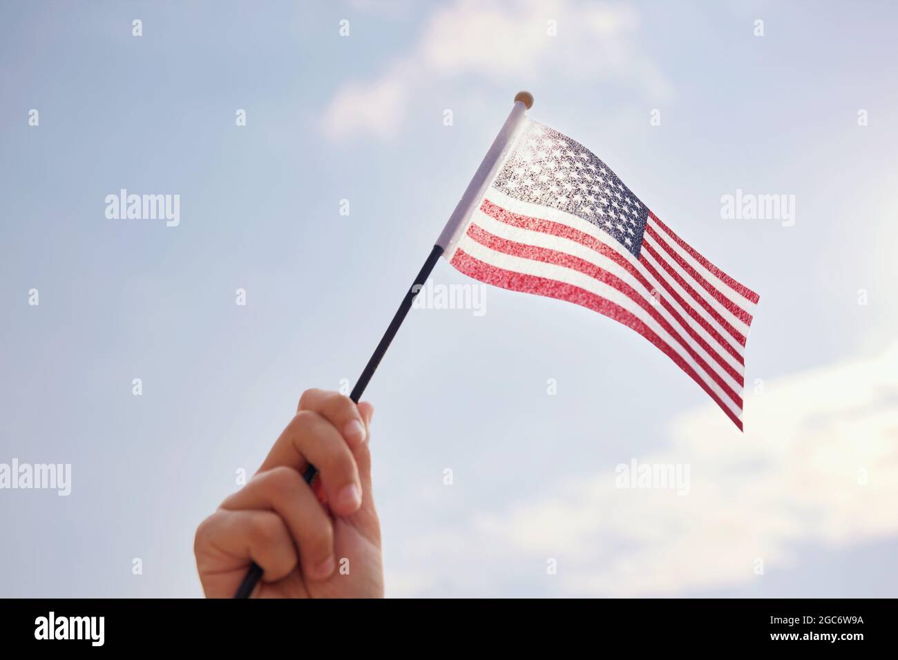 Hand holding American Flag Stock Photo - Alamy