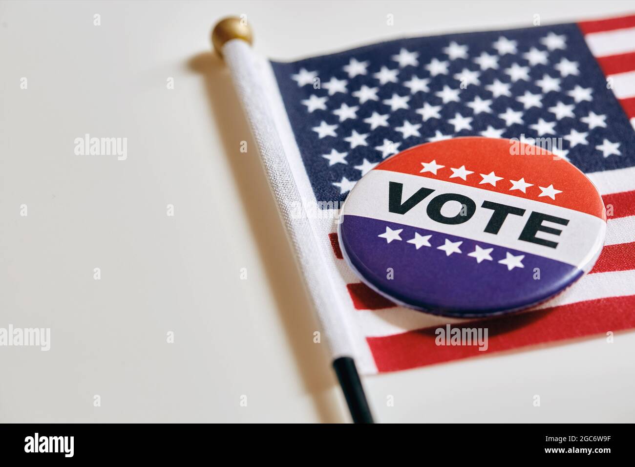 Vote pin on American Flag Stock Photo - Alamy