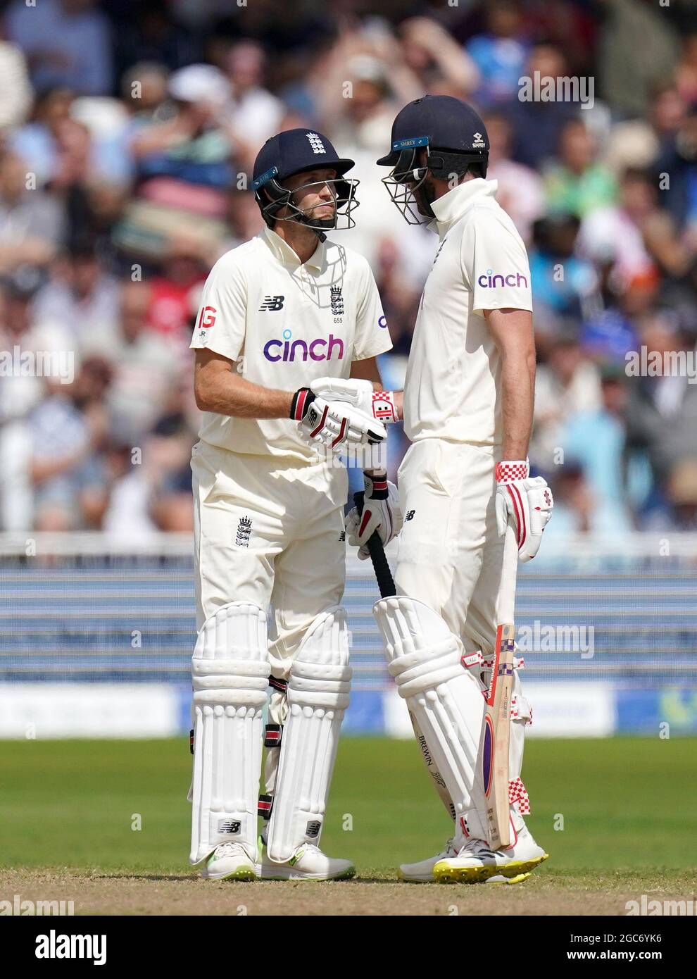 England's Joe Root (left) and Dom Sibley celebrate their 50 partnership ...
