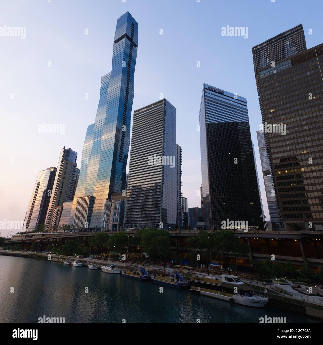Usa, Illinois, Chicago, Downtown skyscrapers at waterfront at dawn ...