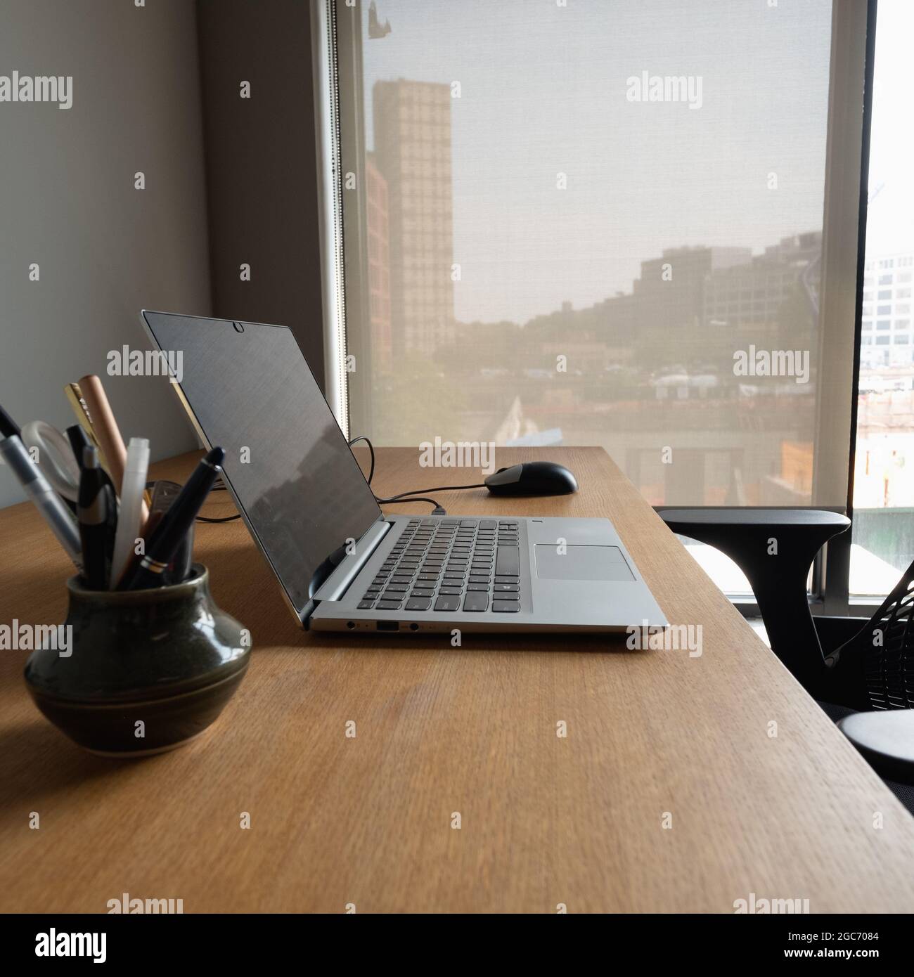 Open laptop on business desk Stock Photo - Alamy