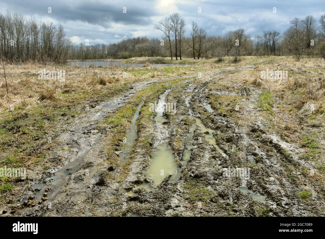 Spring slush and off-road.After the rain, there is mud and puddles on ...