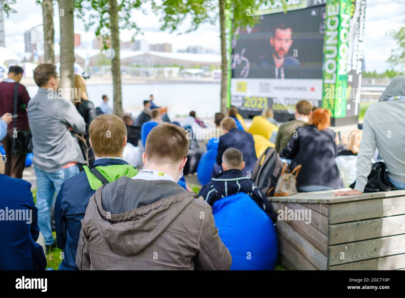 People participating in open air conference Stock Photo - Alamy