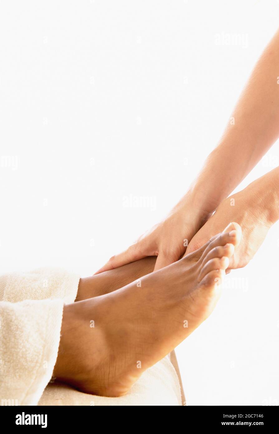 Close-up of woman receiving foot massage Stock Photo - Alamy