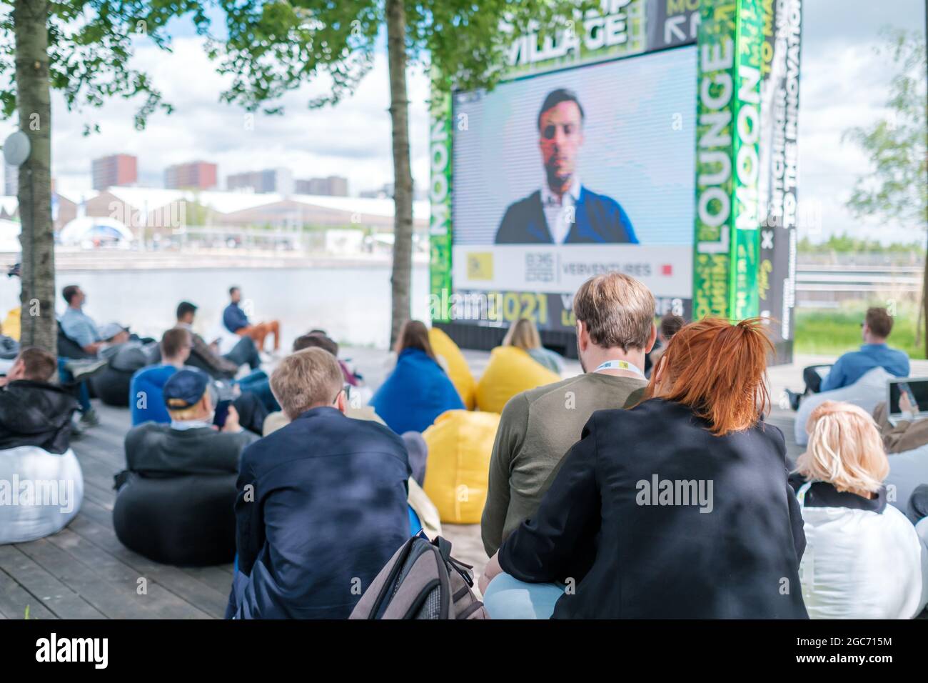People participating in open air conference Stock Photo - Alamy