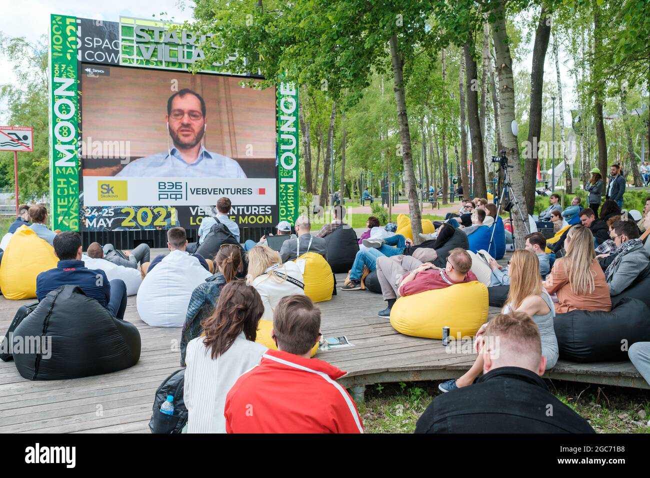 People participating in open air conference Stock Photo - Alamy