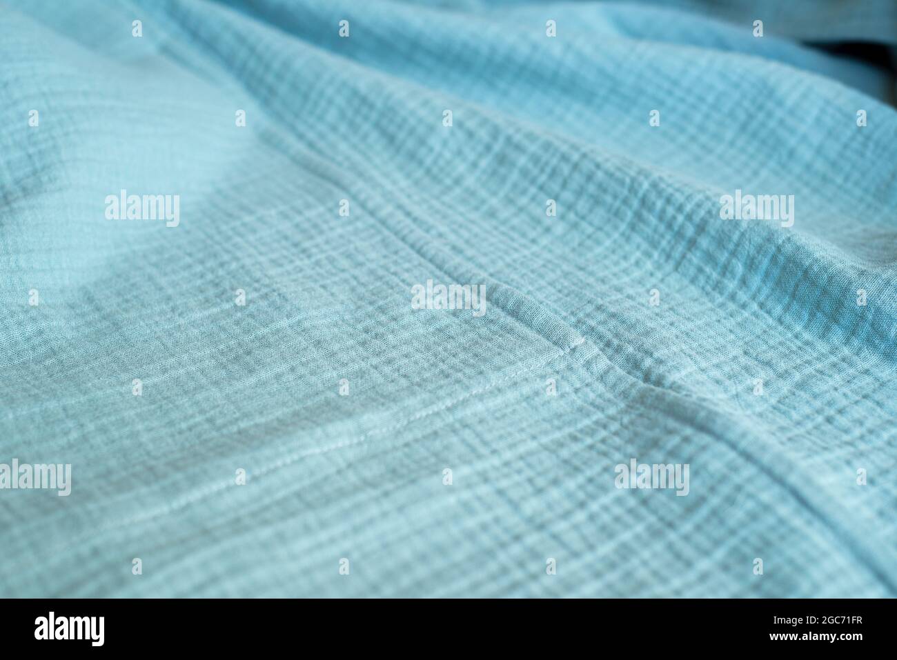 Turquoise muslin fabric. Natural organic cotton textiles Stock Photo ...