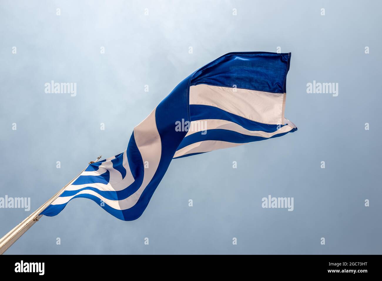 Athens, August 4th 2021: The Greek national flag flying over the ...