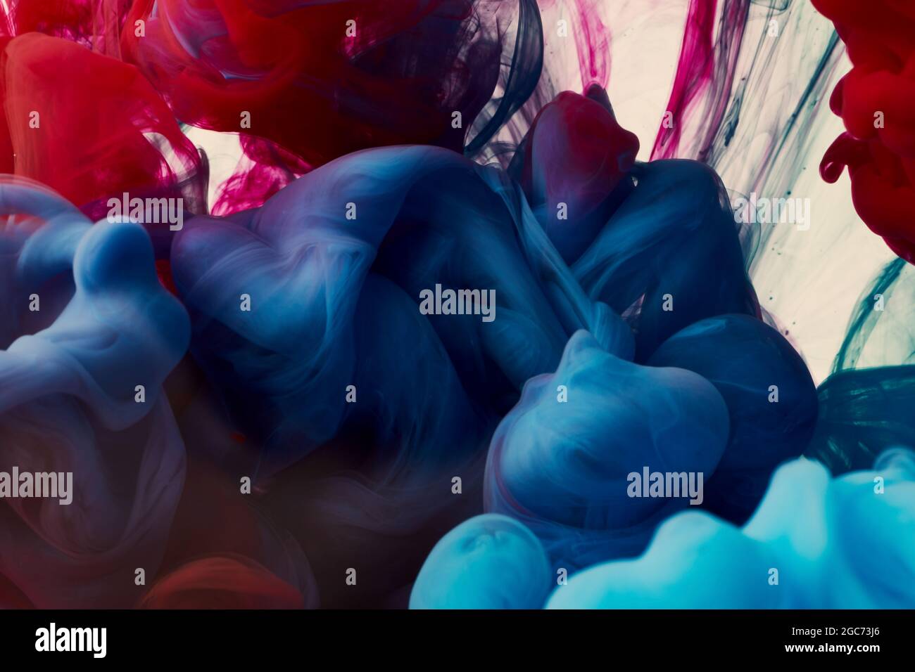 Ink drop in water background Stock Photo - Alamy