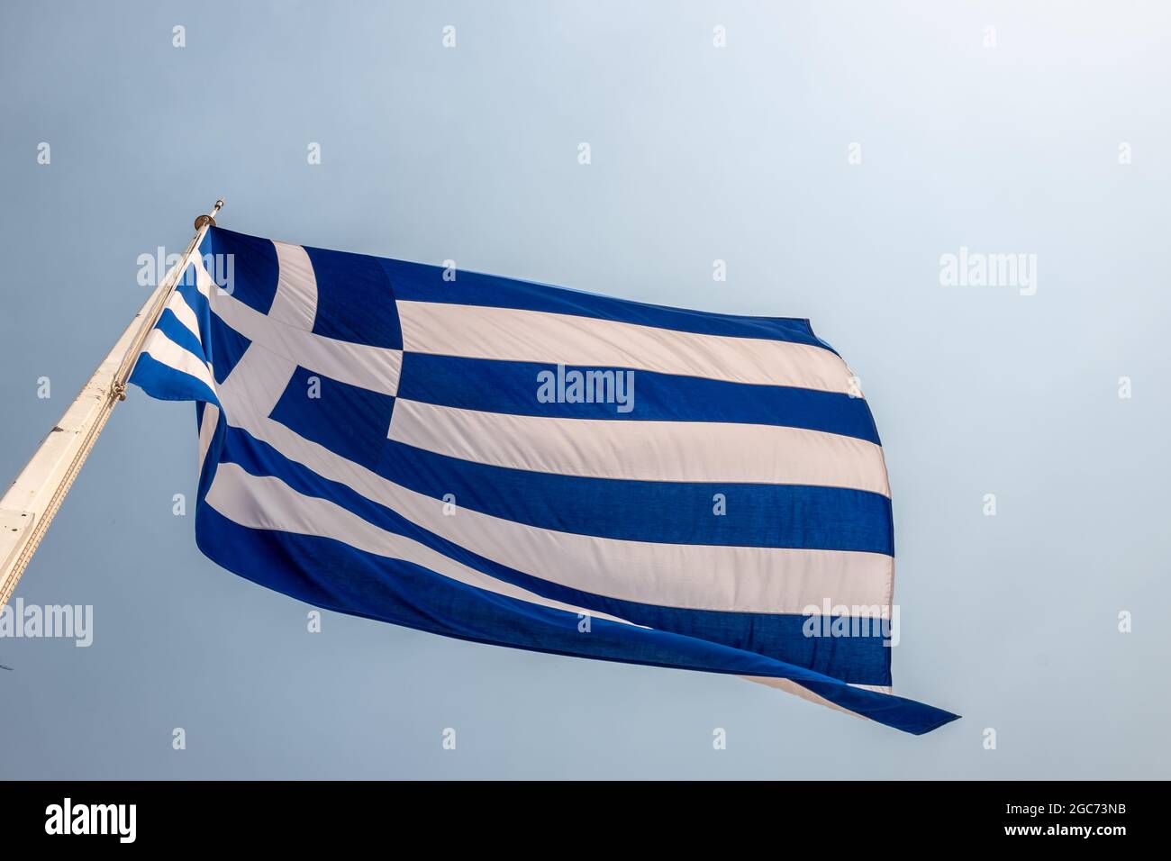 Athens, August 4th 2021: The Greek national flag flying over the ...