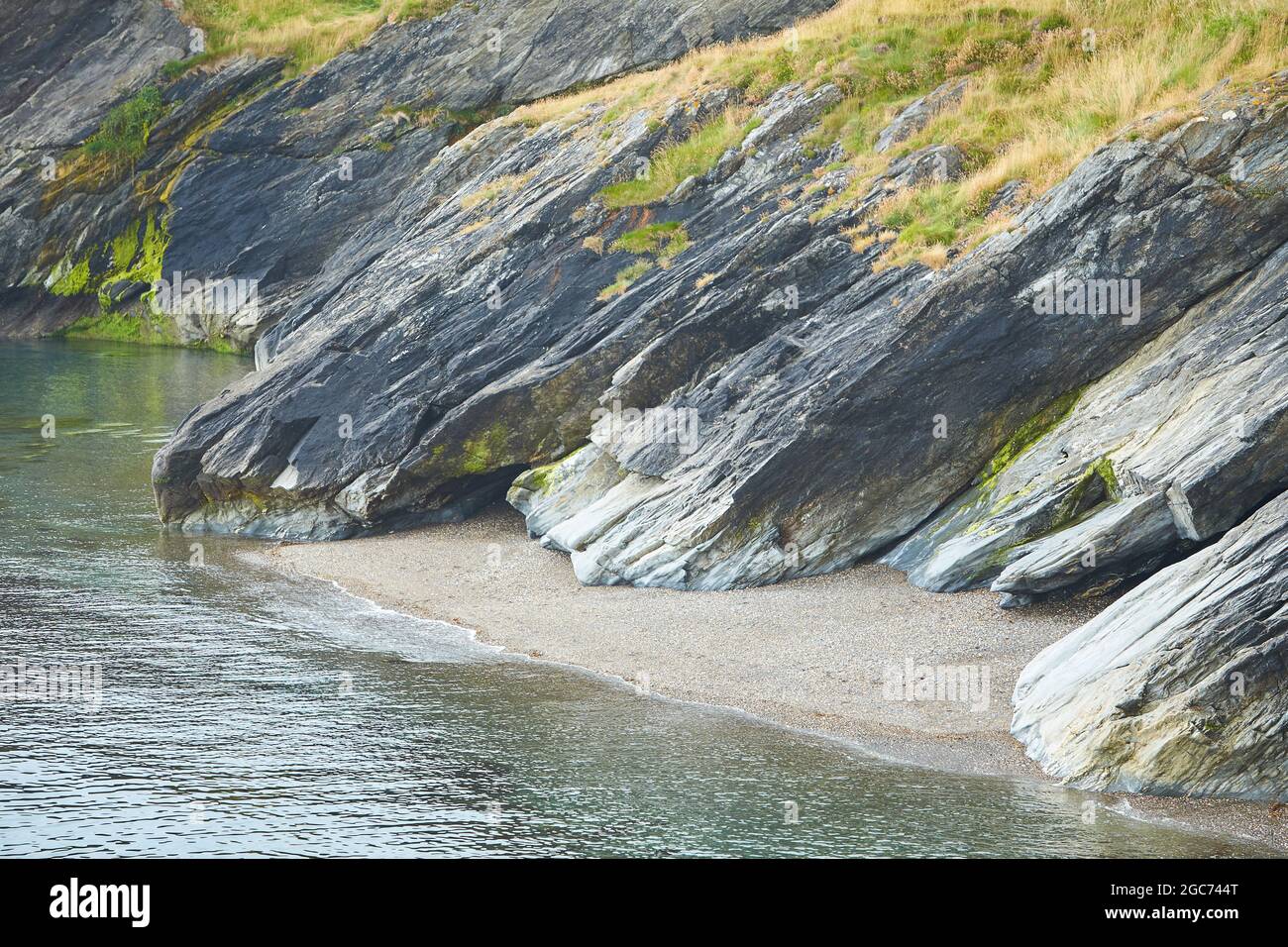 High cliff on tropical beach. Tropical nature. Beautiful blue sea water ...