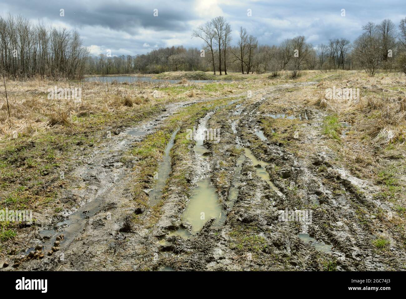 Spring slush and off-road.After the rain, there is mud and puddles on ...