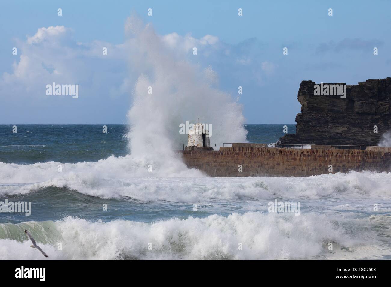 Waves crash across the Monkey Hut in Portreath, Cornwall,UK Stock Photo ...