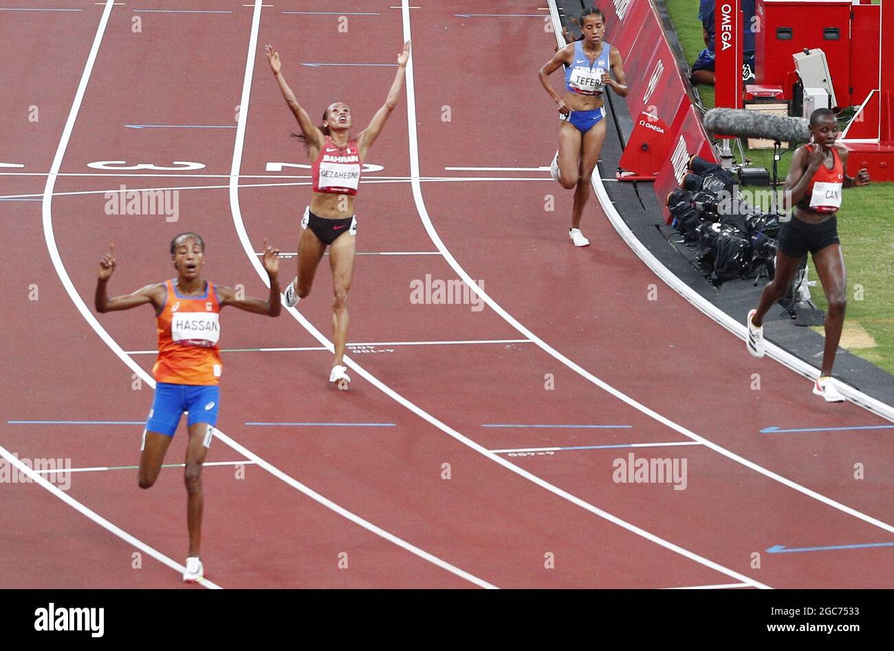 Tokyo, Japan. 07th Aug, 2021. Sifan Hassan of the Netherlands (L) reacts after winning the Women ...