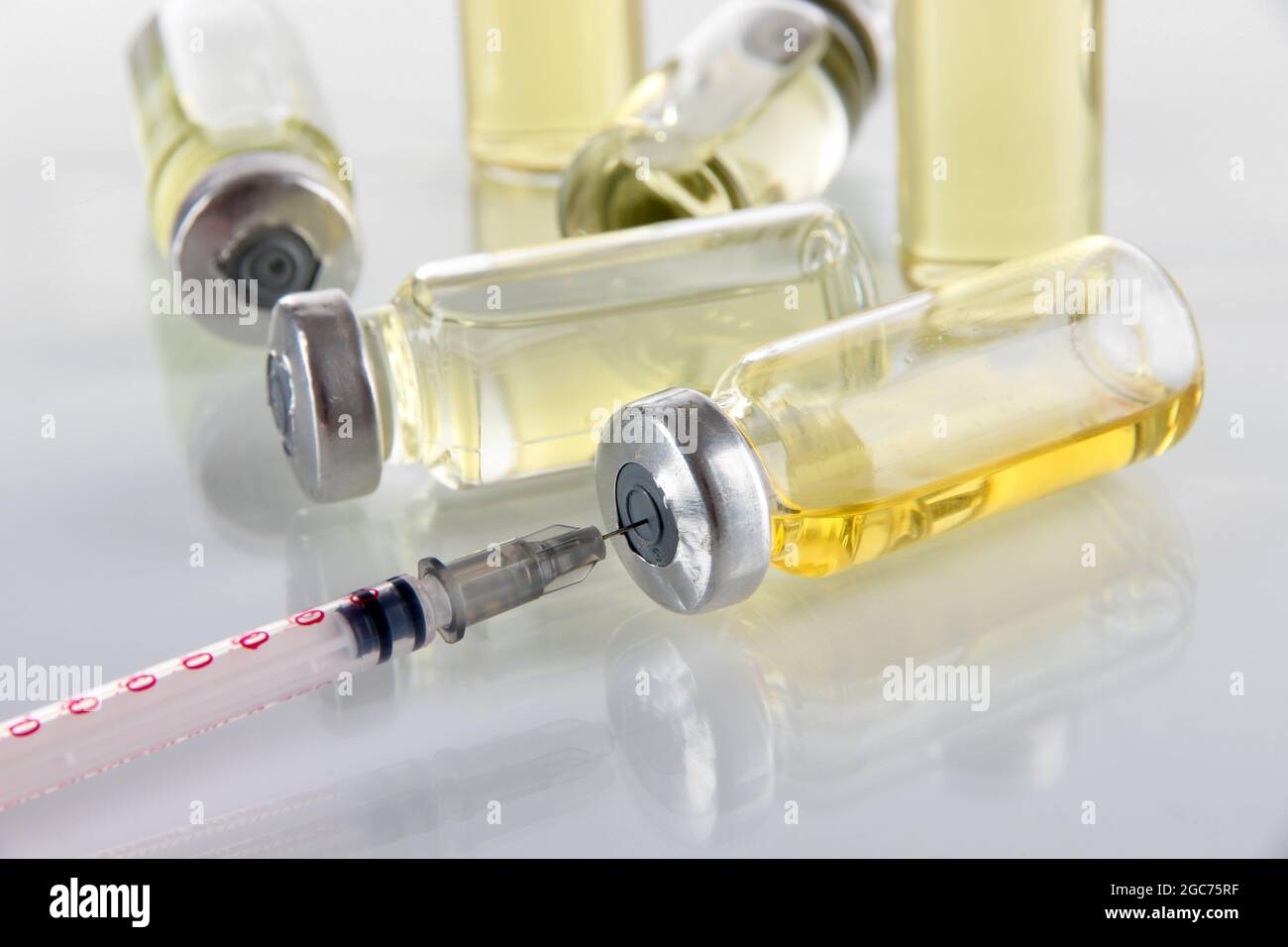 Medical bottle and syringe Stock Photo - Alamy