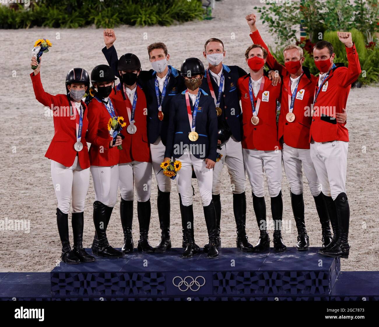 US riders, Swedish riders and Belgian riders celebrate during the medal ...