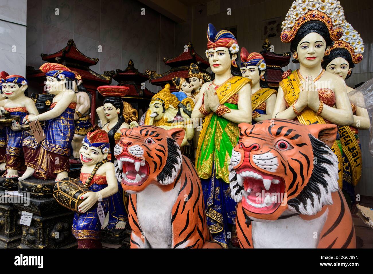 Display of colourful figurines for sale for using in- or around a house ...