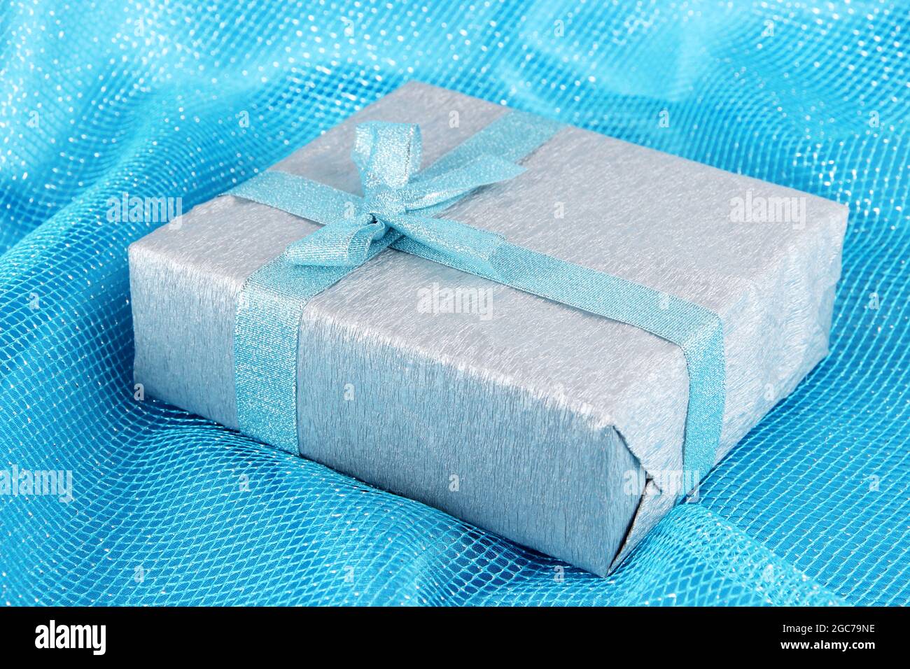 Romantic parcel on blue cloth background Stock Photo - Alamy