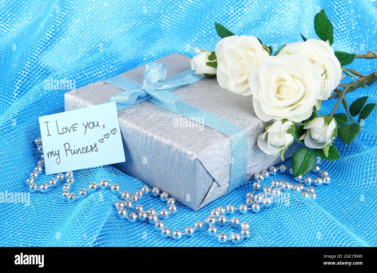 Romantic parcel on blue cloth background Stock Photo - Alamy